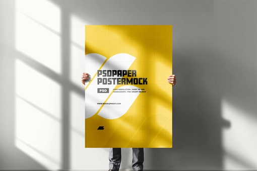 Large Paper Poster Mockup Held in Hands with Sunlight Shadows | Mockupnest